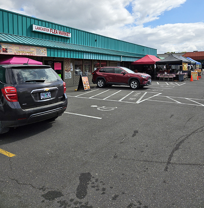 The distinctive teal exterior of Lancaster Flea Market beckons treasure hunters like a retail oasis in Salem's urban landscape.