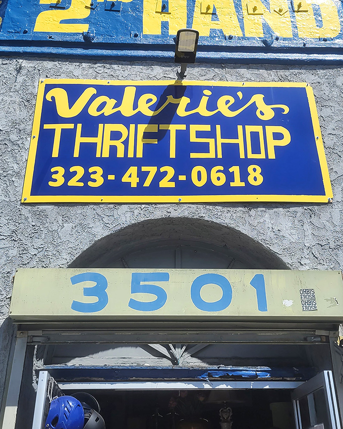 The iconic blue and yellow sign of Valerie's Thrift Shop beckons bargain hunters like a beacon of affordable possibility in Los Angeles.