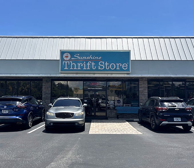 Daytime view of Sunshine Thrift's welcoming storefront, where Florida's most determined treasure seekers begin their quest for secondhand gold.