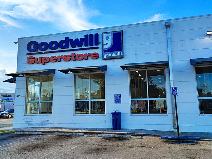 The blue and red Goodwill Superstore sign beckons like a lighthouse for bargain hunters. Florida's thrift paradise awaits behind these unassuming walls.