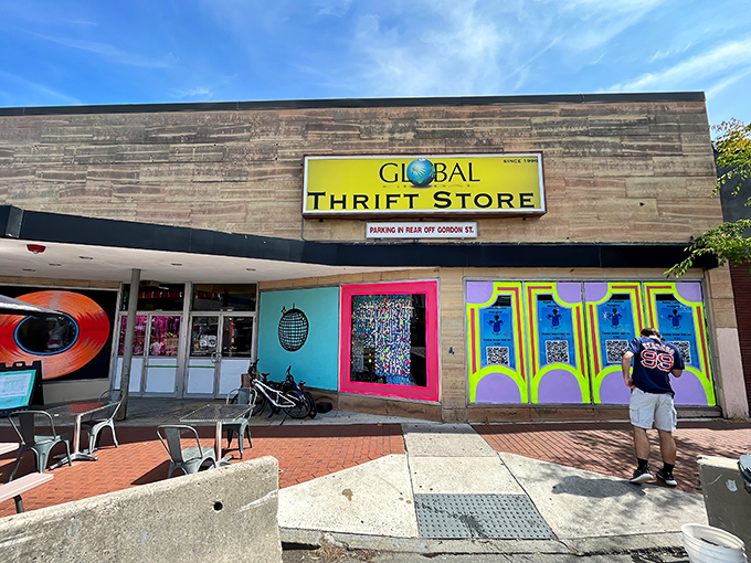The bright yellow sign of Global Thrift stands out against the Waltham skyline like a beacon for bargain hunters. Treasure awaits inside!