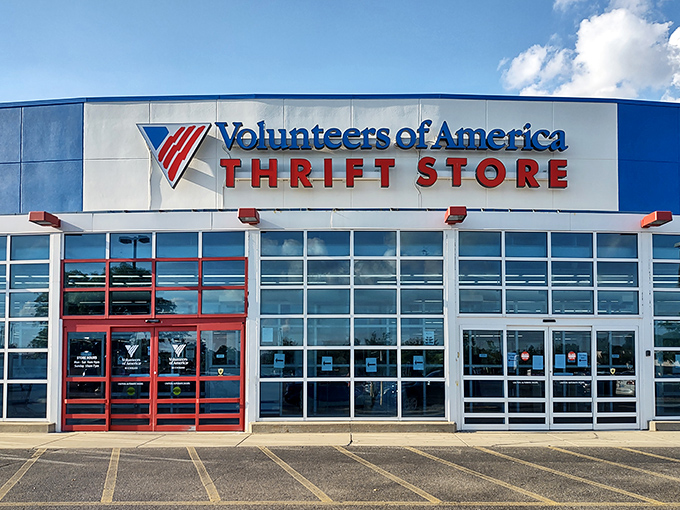 The blue and red exterior beckons like a retail lighthouse for bargain hunters. Behind those windows lie treasures waiting to be discovered by savvy Michigan shoppers.