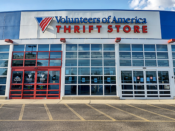 The bright blue exterior of Volunteers of America in Westland stands like a beacon for bargain hunters, promising treasures within its expansive walls.