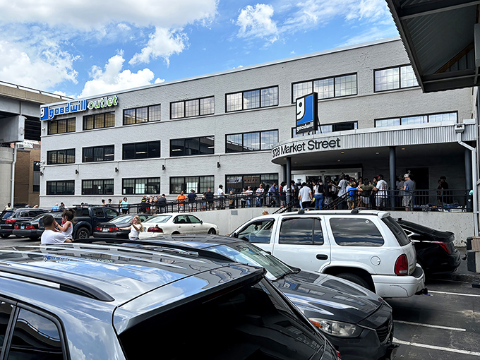 The unassuming exterior of MERS Goodwill Outlet on Market Street hides a treasure hunter's paradise within. The line of eager shoppers gives away the secret.