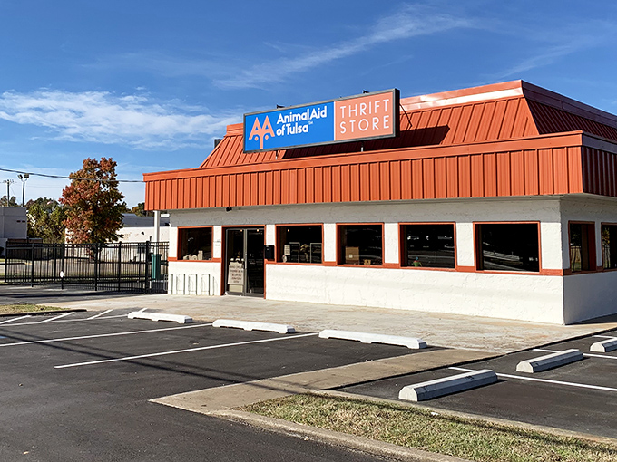 The distinctive red-roofed building stands out like a beacon for bargain hunters. Inside this unassuming exterior lies a treasure trove of second-hand wonders.