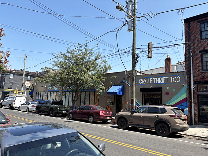 The colorful exterior of Circle Thrift Too beckons from a Philadelphia street corner, promising treasures within its unassuming walls.