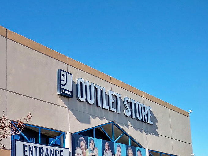 The iconic Goodwill smile logo welcomes treasure hunters to this Austin mecca of secondhand finds. Blue skies promise a day of discovery ahead.