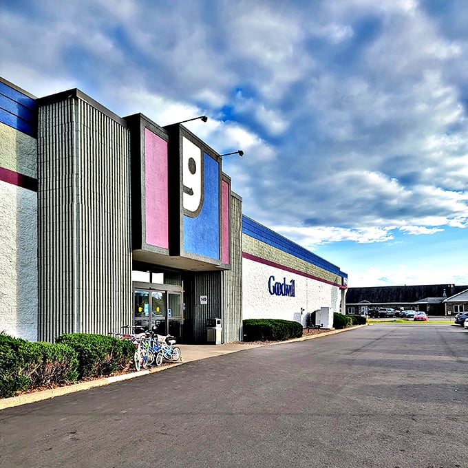The iconic Goodwill smile greets bargain hunters under Wisconsin skies. This architectural happy face has launched countless treasure hunting expeditions.