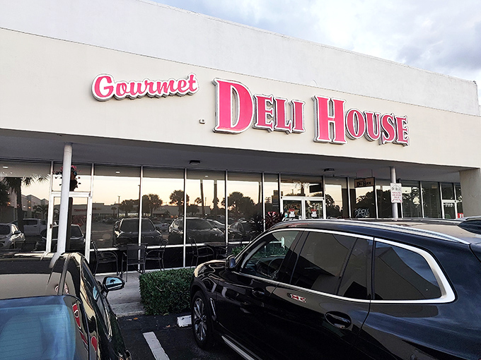 The kind of storefront that whispers "serious sandwiches inside" while the parking lot practically screams customer approval.