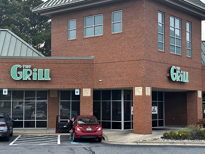 The brick exterior of The Grill at Quarterfield Station stands unassuming yet inviting, like that reliable friend who never brags but always delivers.