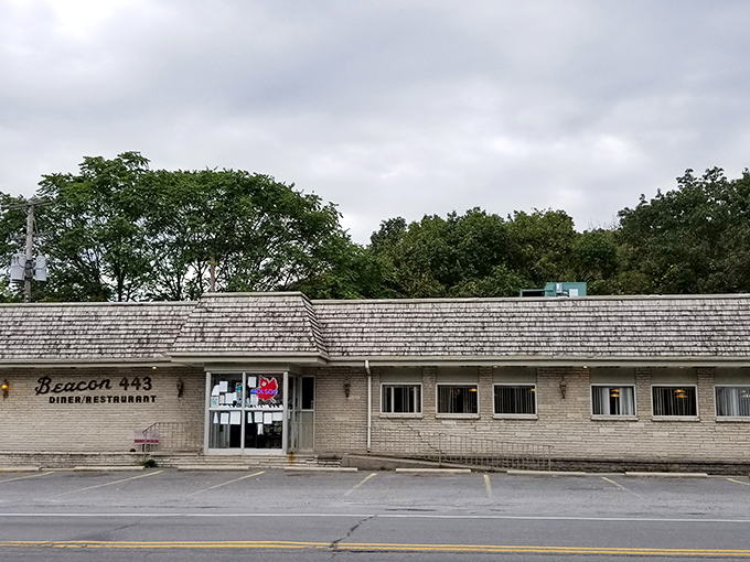The classic roadside sign beckons like an old friend &ndash; Beacon 443's weathered charm promising comfort food salvation for hungry Pennsylvania travelers.
