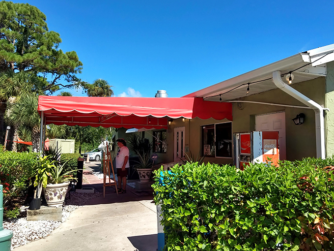 The unassuming pink exterior of Sebastian's Roadside Restaurant proves once again that culinary treasures often hide in plain sight.