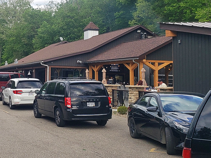 The rustic charm of The Bear's Den beckons from the roadside, promising carnivorous delights within its timber walls. No GPS required&mdash;just follow the scent of sizzling steaks.