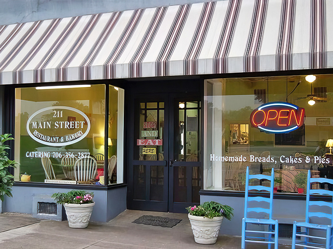 The charming storefront of 211 Main Street beckons with its purple trim and welcoming benches &ndash; like a small-town hug in architectural form.