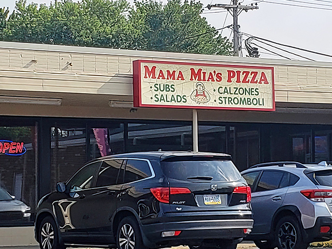 The unassuming storefront of Mama Mia's Pizza in Erie &ndash; where pizza pilgrimages begin and diet resolutions go to die.