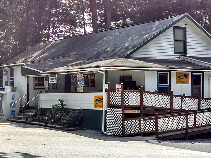 Nestled among towering pines, this unassuming white building holds culinary treasures that would make fancy city delis weep with envy.
