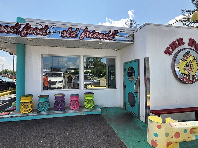 The Poky Dot's exterior is like a color explosion in the West Virginia hills &ndash; those painted tire seats aren't just decoration, they're your first clue that conventional dining has left the building.