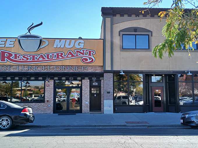 The iconic Coffee Mug sign beckons hungry travelers like a desert oasis, promising comfort food salvation on Elko's main drag.