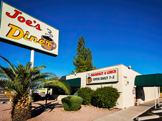 The sunshine-yellow exterior of Joe's Diner stands out against Phoenix's blue sky like a beacon for breakfast enthusiasts seeking refuge from trendy brunch spots.