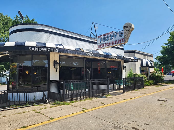 The boat-shaped exterior of Fuzzy's Restaurant stands like a culinary lighthouse in Saginaw, complete with that iconic ice cream cone sign beckoning hungry travelers.