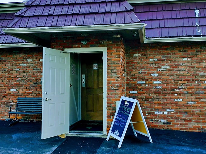 The unassuming entrance to O'Gillies, with its distinctive purple roof, proves once again that culinary treasures often hide behind modest doors.