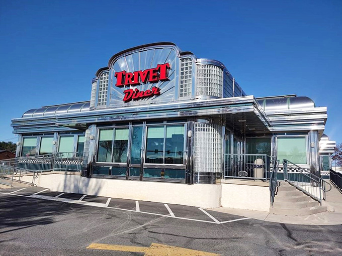 The gleaming chrome exterior of Trivet Diner stands like a time machine to America's golden age of roadside dining, complete with that iconic red signage.