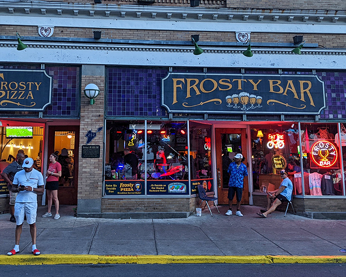 The iconic blue Frosty Bar sign welcomes hungry travelers like a beacon of hope. Island time officially begins when you walk through these doors.