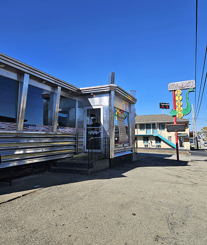 The gleaming stainless steel exterior of Summit Diner stands as a beacon of hope for hungry travelers&mdash;a chrome time machine promising delicious possibilities inside.