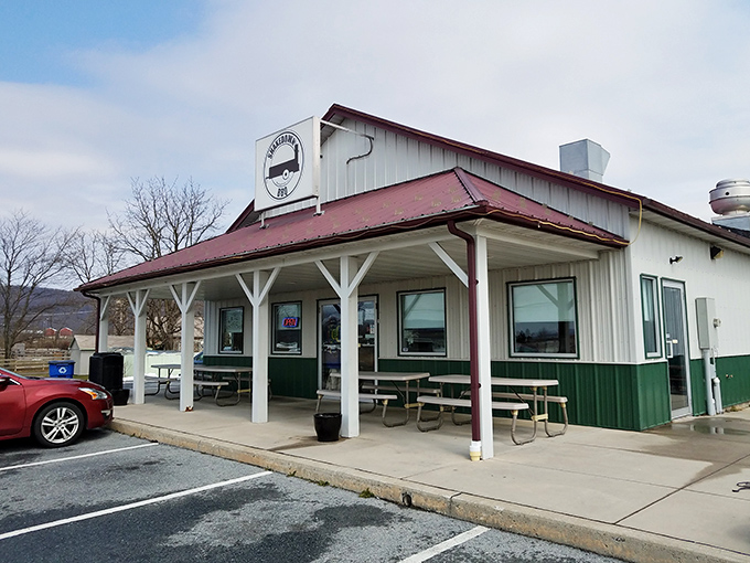 Stone accents and modern lines create a surprisingly sophisticated entrance that whispers "serious barbecue lives here."