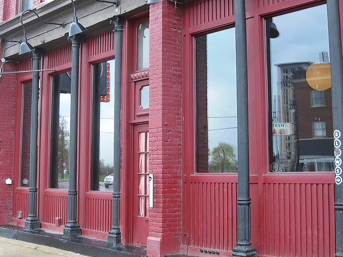 The crimson facade of Slows isn't just a building&mdash;it's a beacon for barbecue pilgrims seeking smoky salvation in Detroit's Corktown neighborhood.