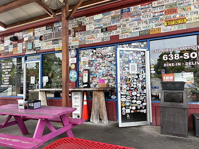 BBQ paradise doesn't need fancy signage when the aroma does the talking. The sticker-covered door and license plate collection speak volumes about Southern Soul's devoted following.