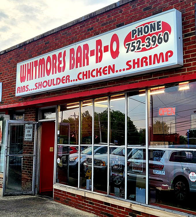 The bold red and white sign promises exactly what you'll find inside: no-nonsense barbecue that lets the smoke do the talking.