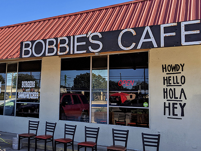 The pale green exterior with classic black and white awnings isn't trying to impress anyone&mdash;it's saving all that energy for what happens in the kitchen.