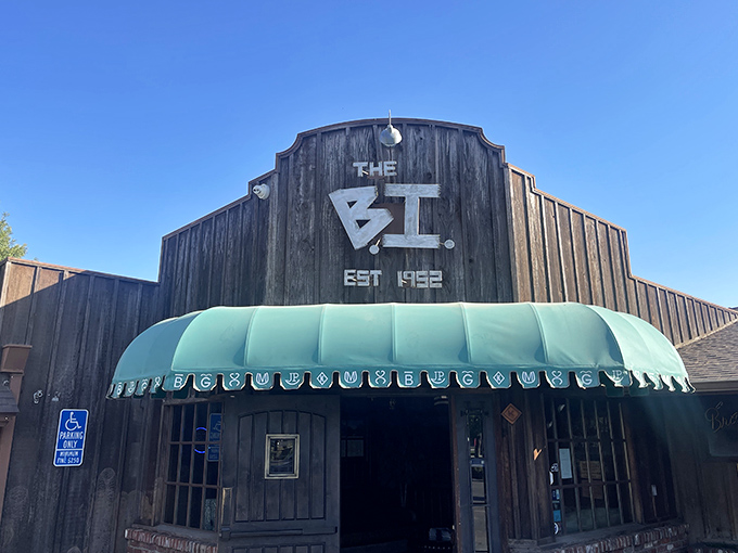 "The BI" glows like a beacon of deliciousness against the night sky, promising treasures within.