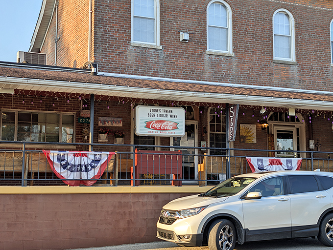 The historic brick exterior of Stone's Family Restaurant stands as a humble sentinel of flavor in tiny Millhousen, promising culinary treasures within.