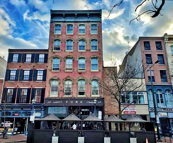 Fork's understated exterior belies the culinary magic happening inside. The elegant signage and classic brick fa&ccedil;ade set the perfect stage for what's to come.