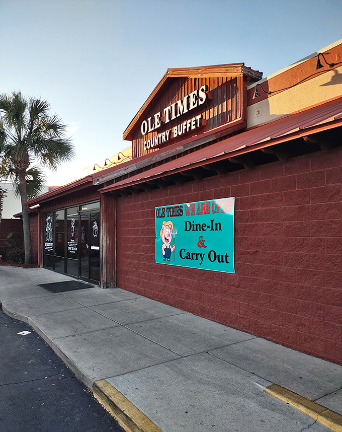 The rustic barn-like exterior of Ole Times Country Buffet promises what every road trip needs&mdash;comfort food that doesn't apologize for being exactly what it is.