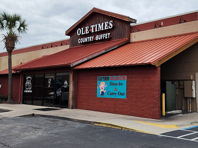 The red-roofed sanctuary of Southern comfort food stands proudly against the Florida sky, palm tree standing sentinel like a hungry diner waiting for the doors to open.