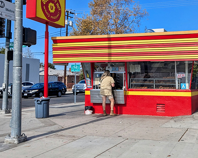 The red and yellow striped exterior of Donut Hut stands out like a beacon of sugary hope on this Burbank corner. Simple, unpretentious, and promising deliciousness.