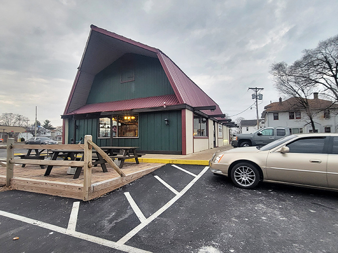 The distinctive A-frame with its forest green siding and cherry-red roof stands like a culinary lighthouse, beckoning hungry travelers on North Main Street.