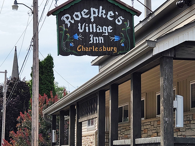 The iconic sign beckons hungry travelers like a lighthouse for the famished. Roepke's Village Inn promises comfort food salvation in Charlesburg's countryside.