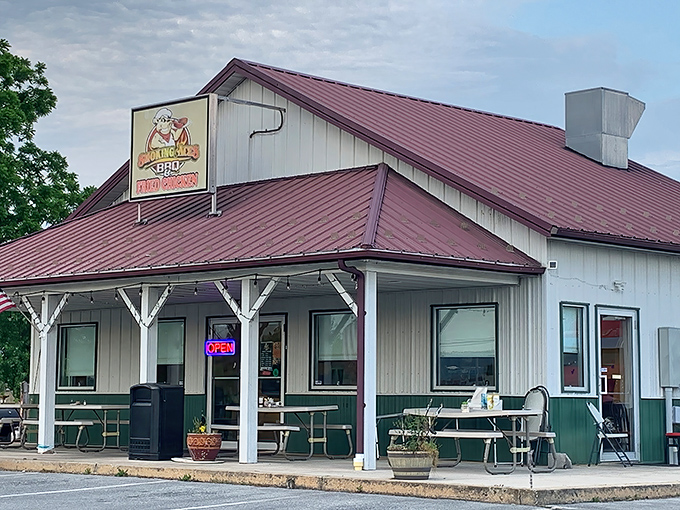The iconic red roof and cartoon pig logo of Smoking Aces BBQ stand as a beacon of hope for hungry travelers on Pennsylvania's backroads.