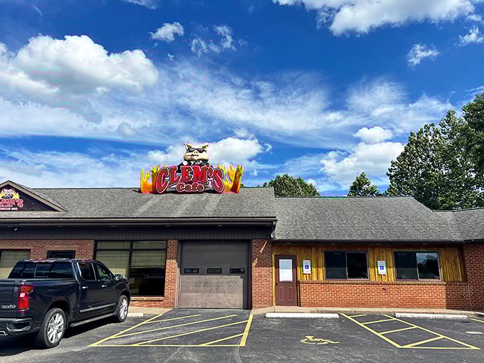 Blue skies frame this barbecue sanctuary like nature's own endorsement. The humble exterior belies the extraordinary flavors waiting just beyond those brick walls.