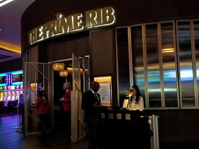 The Prime Rib's entrance beckons like a portal to a more elegant era, where dinner jackets weren't optional and martinis were mandatory.