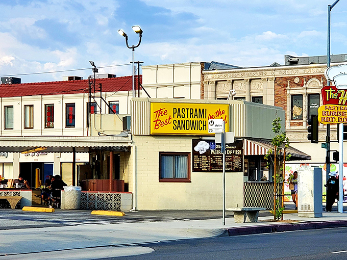 The bold yellow sign makes no modest claims - "The Best PASTRAMI SANDWICH in the World." In California, fighting words that The Hat backs up deliciously.