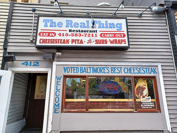 The modest storefront boldly proclaims its champion status. Like finding a Grammy winner performing in your neighbor's garage—unassuming yet extraordinary.