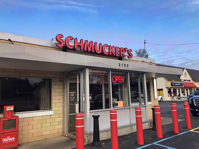 The unassuming yellow brick exterior of Schmucker's stands as a time capsule on Reynolds Road, those red bollards practically shouting, "Good food happens here!"