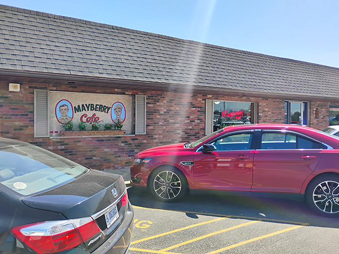 Sunlight streams across the parking lot, illuminating the Mayberry Cafe sign that's been beckoning hungry travelers and locals alike for decades.