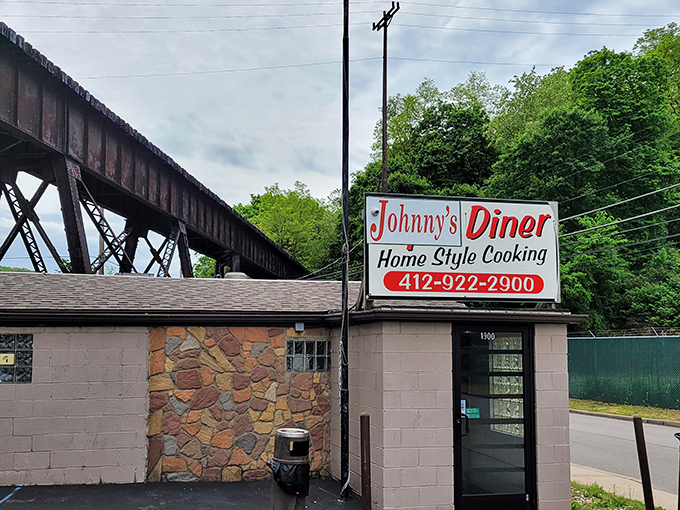 Tucked beneath Pittsburgh's industrial embrace, this humble diner proves that extraordinary breakfast adventures hide behind ordinary facades.