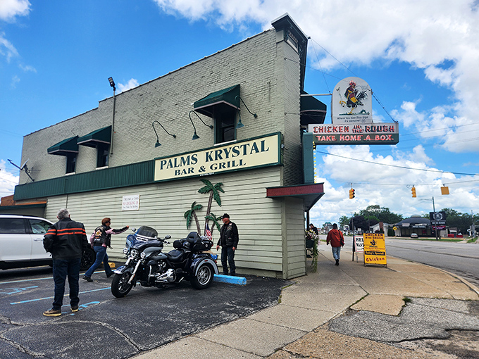 The iconic Palms Krystal Bar & Grill exterior stands as a time capsule in Port Huron, complete with vintage signage that's been beckoning hungry travelers for generations.